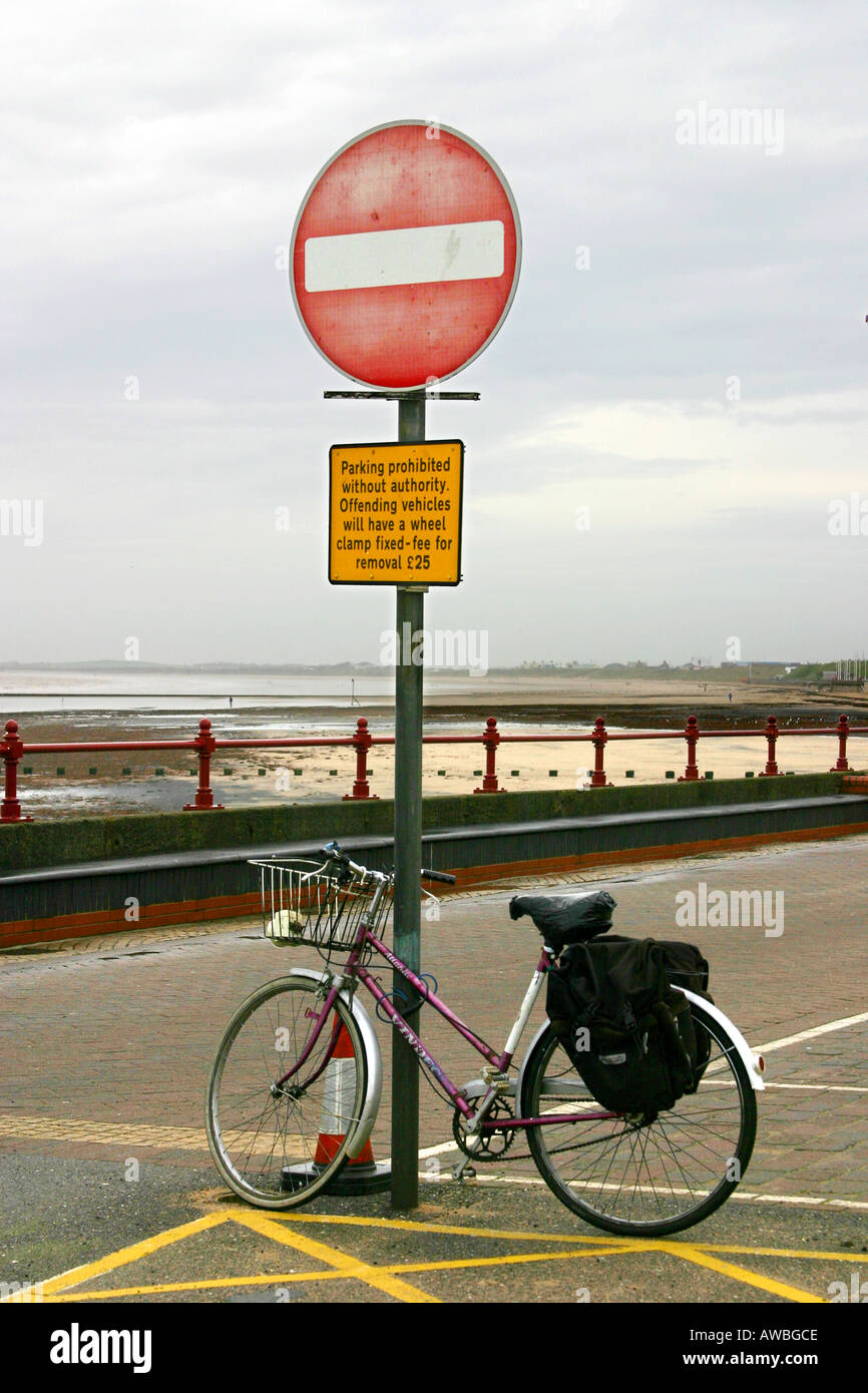 Bicycle leaning against no entry and parking prohibited sign on ...