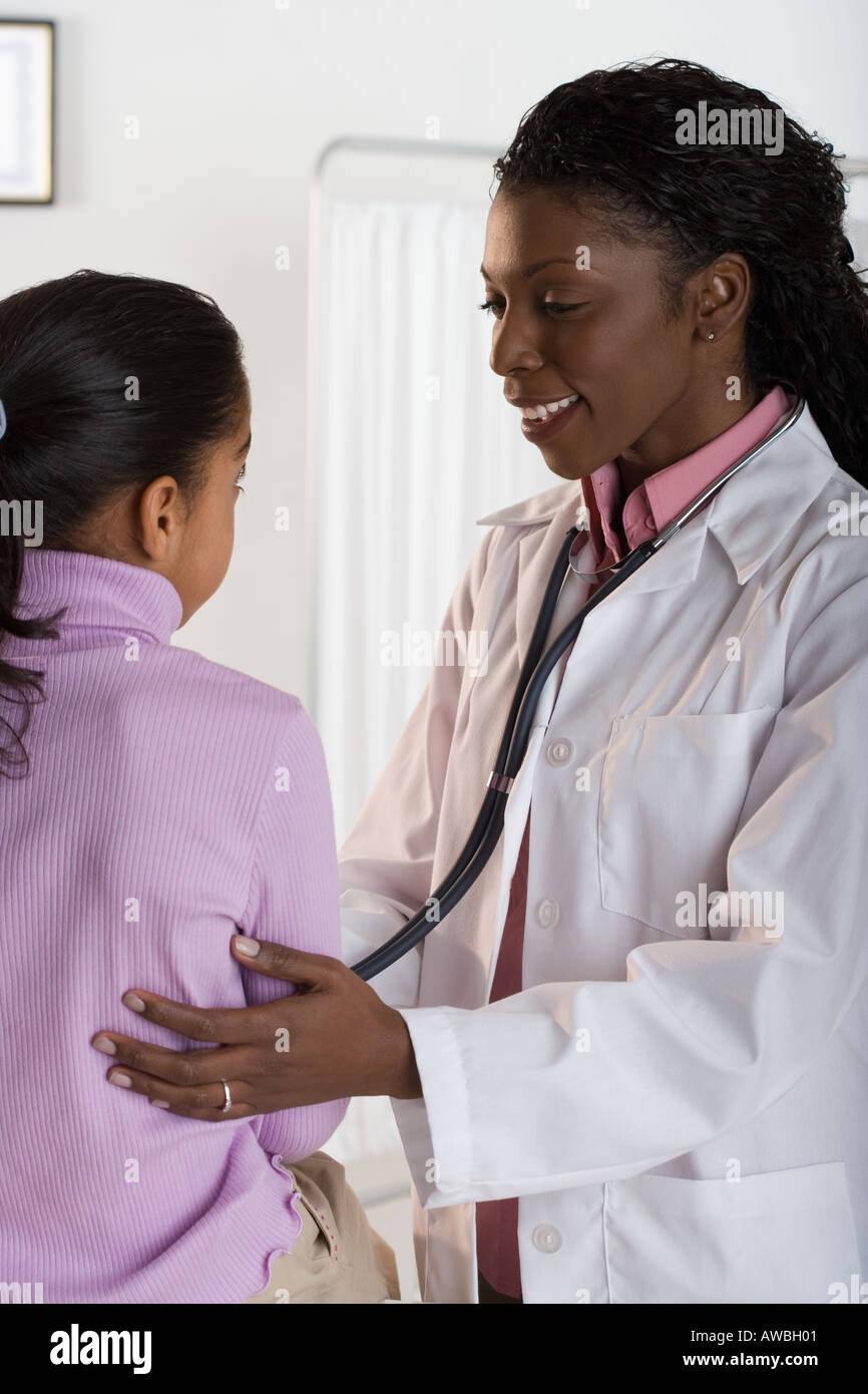 Girl getting check up from pediatrician Stock Photo - Alamy