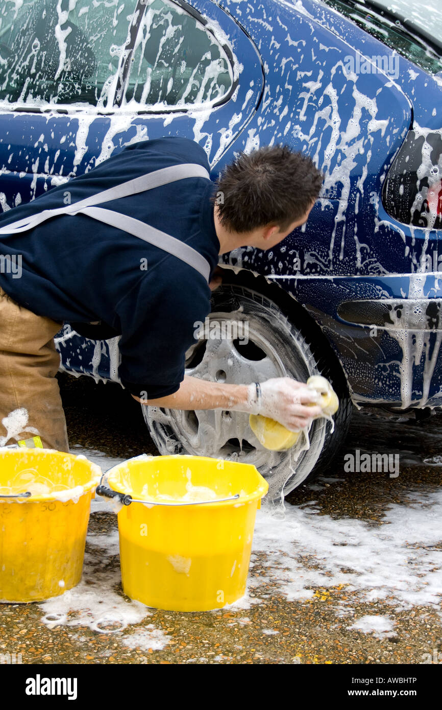 fireman washing car for charity, sussex england uk Stock Photo - Alamy