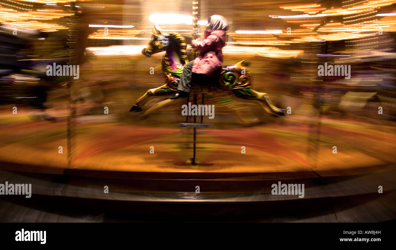 Child riding on funfair roundabout horse ride London UK Stock Photo - Alamy