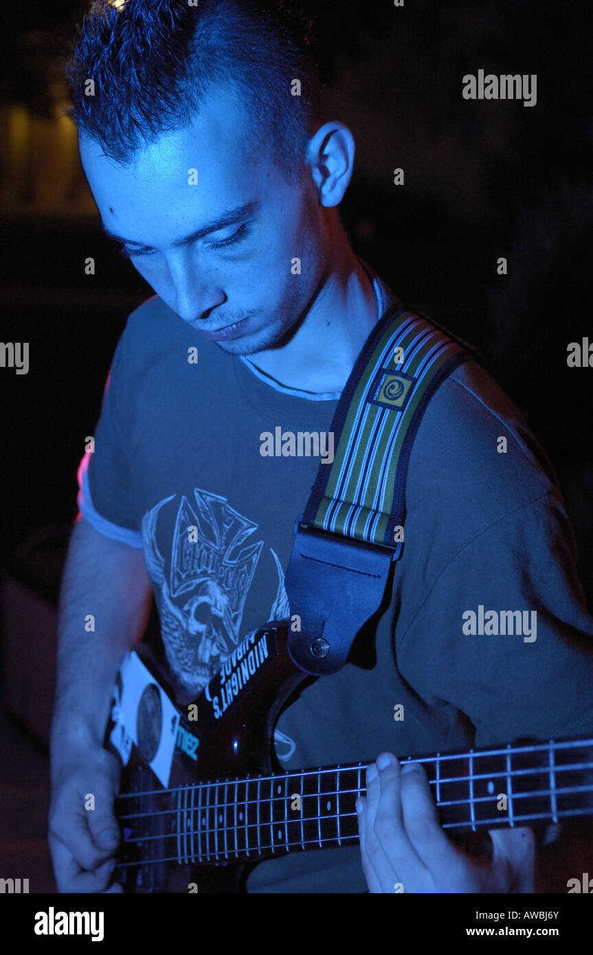 A teenage male bass player performs during a concert Stock Photo - Alamy