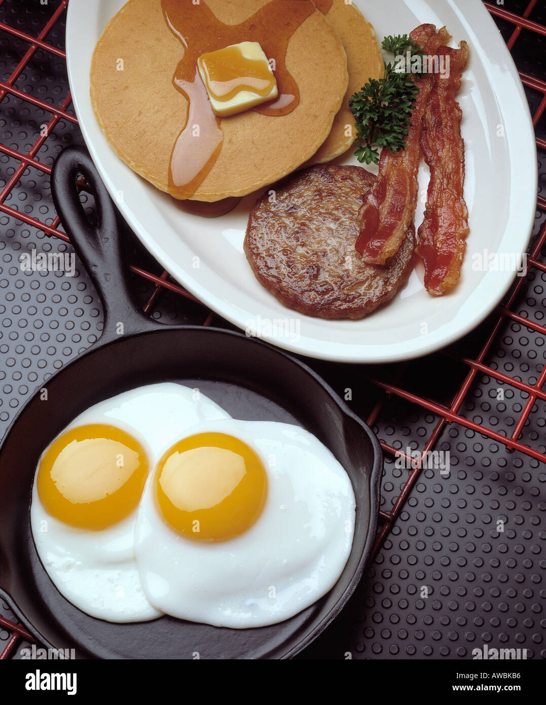 breakfast assortment two fried eggs suny side up fry frying pan stack ...