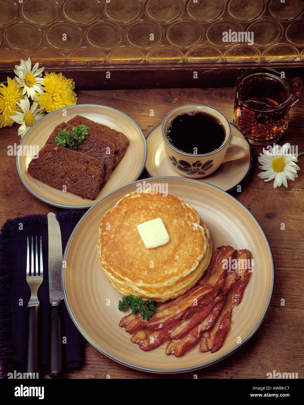 breakfast platter stack of pancakes melted butter syrup strips of bacon ...