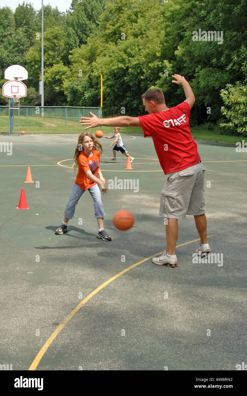 Girl bouncing a basketball hi-res stock photography and images - Alamy