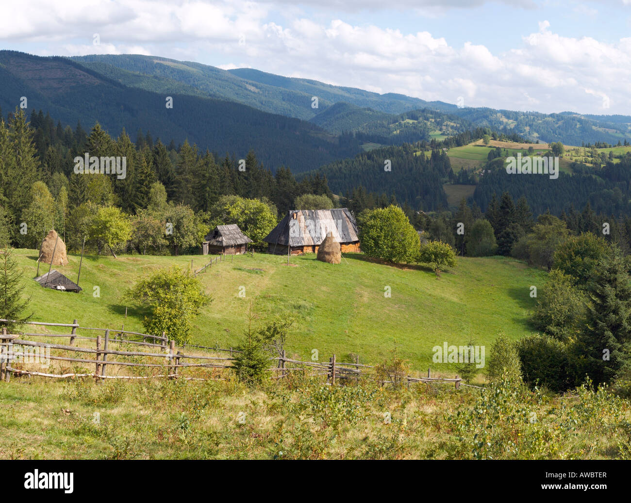 Summer mountainous green glade with small country estate. Four shots ...