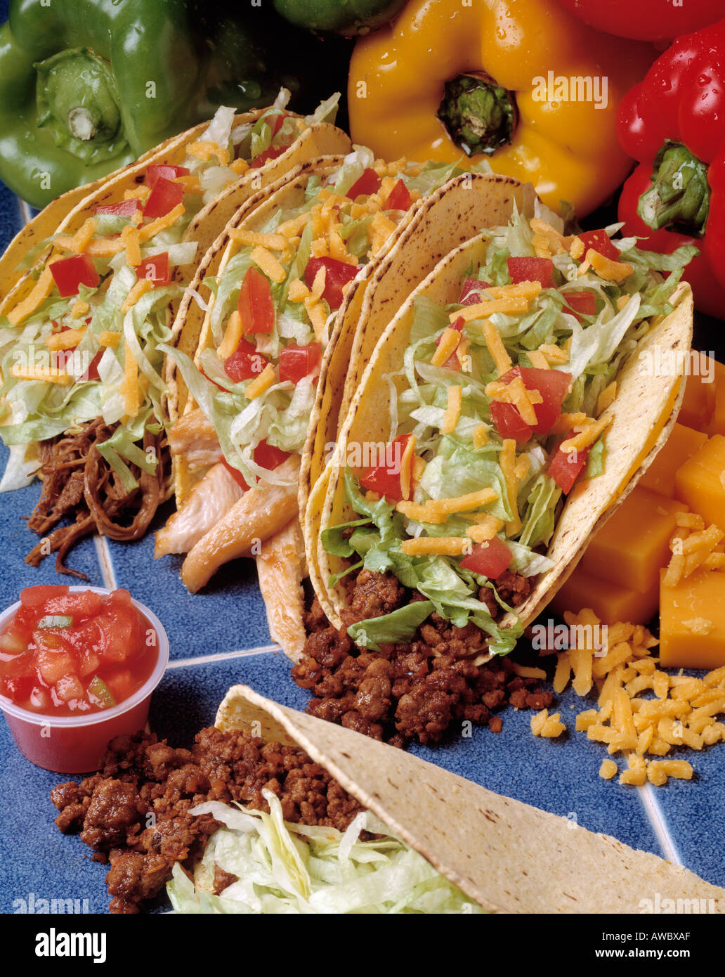 assortment three hard shell tacos beef chicken steak cheese lettuce ...