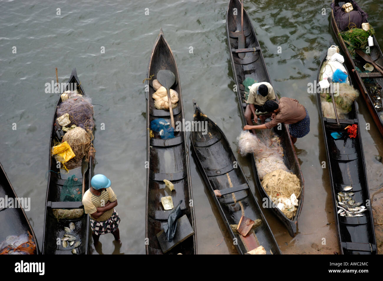 FISHING BOATS WITH DAYS CATCH IN VARKALA BACKWATERS Stock Photo - Alamy