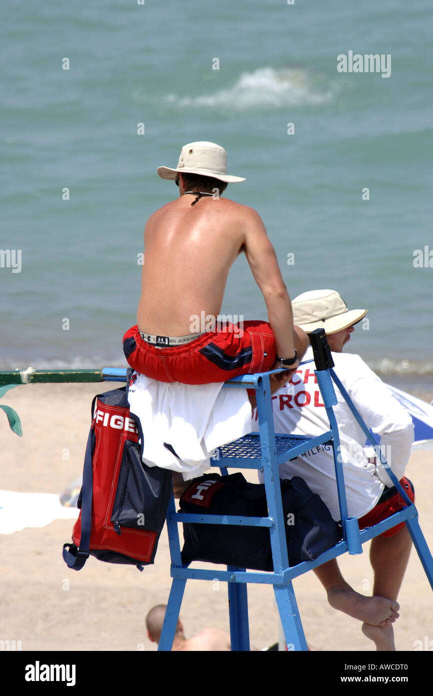 Lifeguard sitting on tower keeping hi-res stock photography and images ...