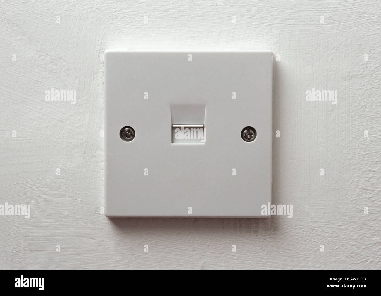Single white plastic telephone socket on white wall Stock Photo - Alamy