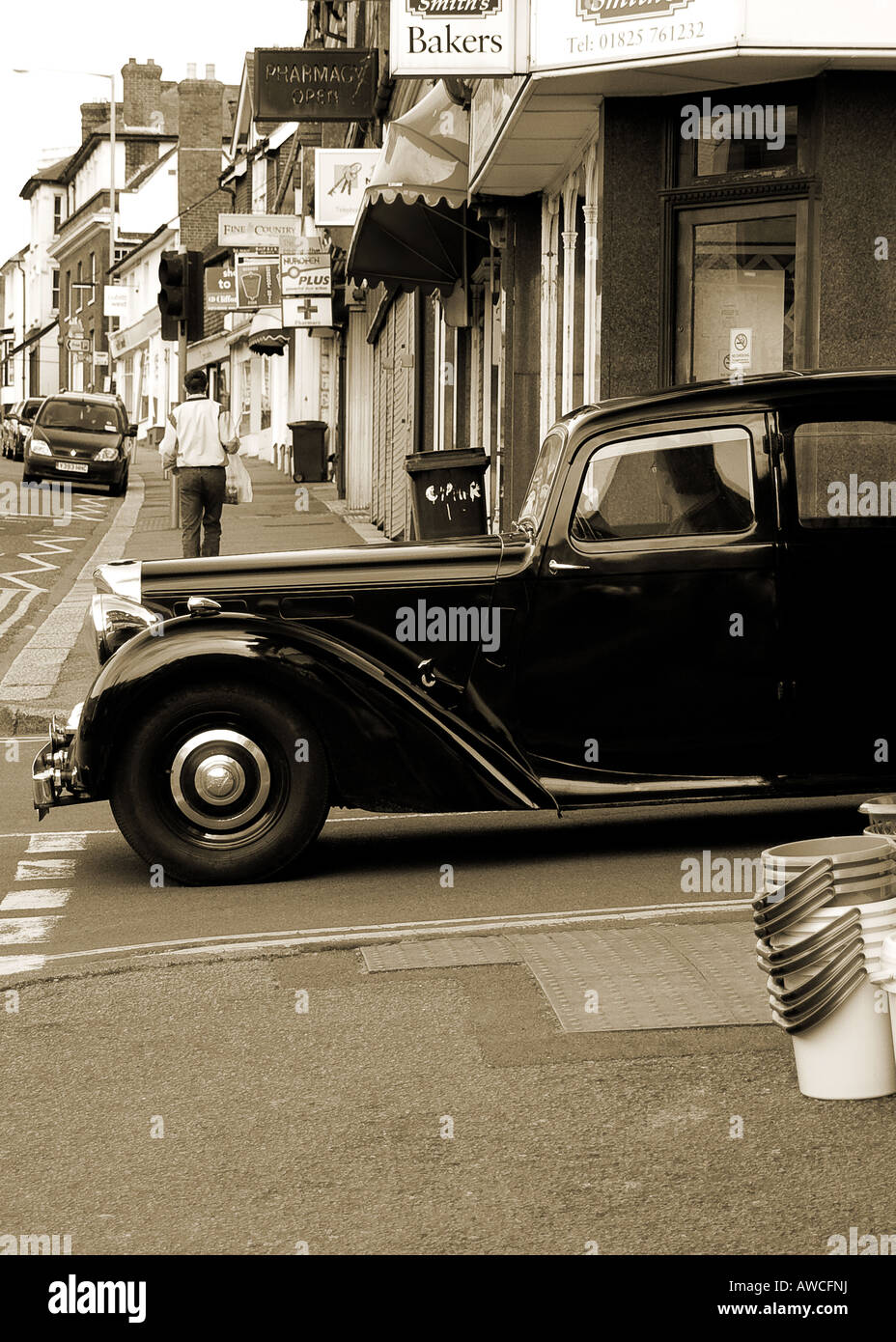 vintage classic posh car on modern town street in sepia Stock Photo - Alamy