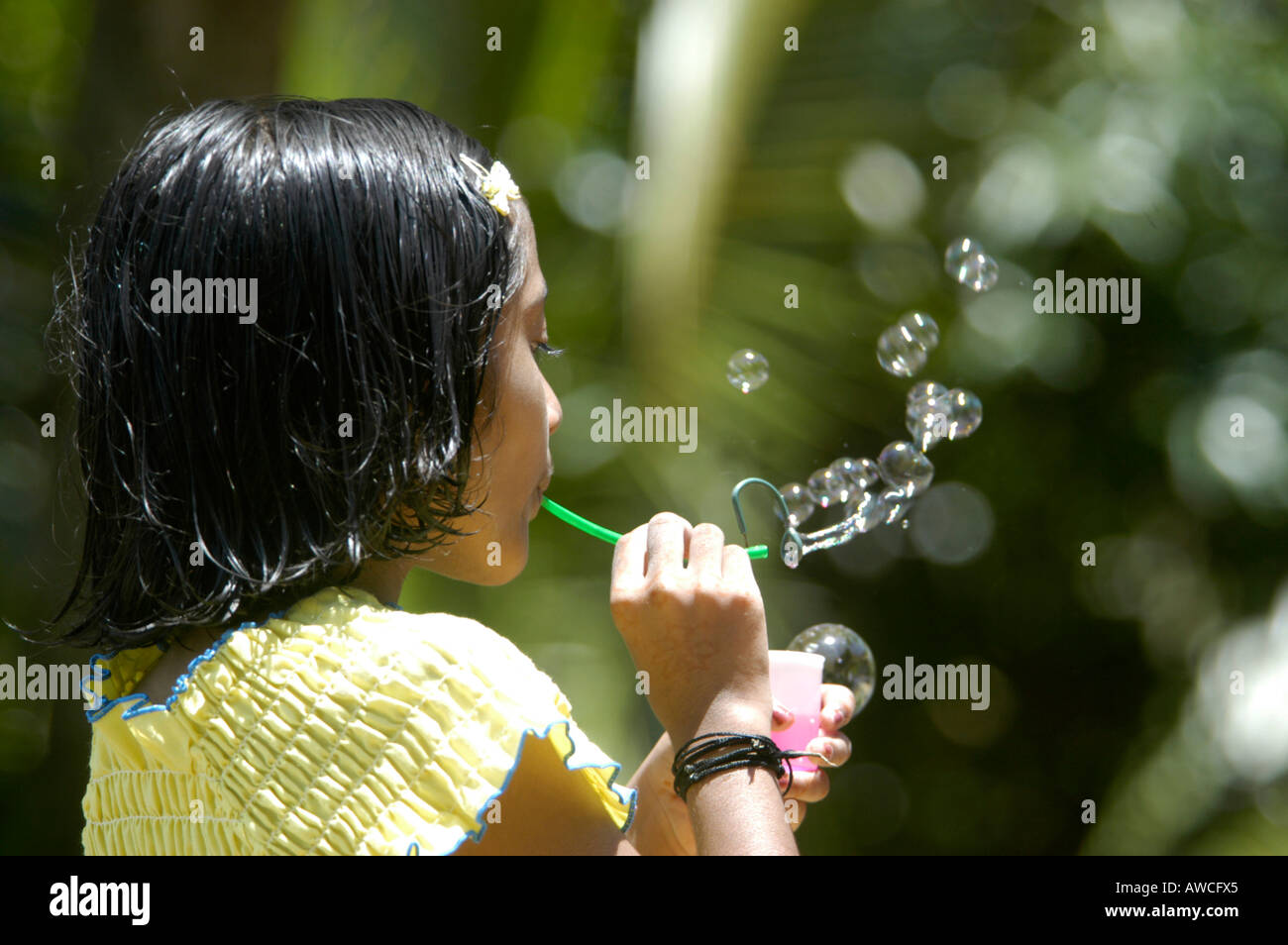 CHILD MAKING SOAP BUBBLES Stock Photo - Alamy