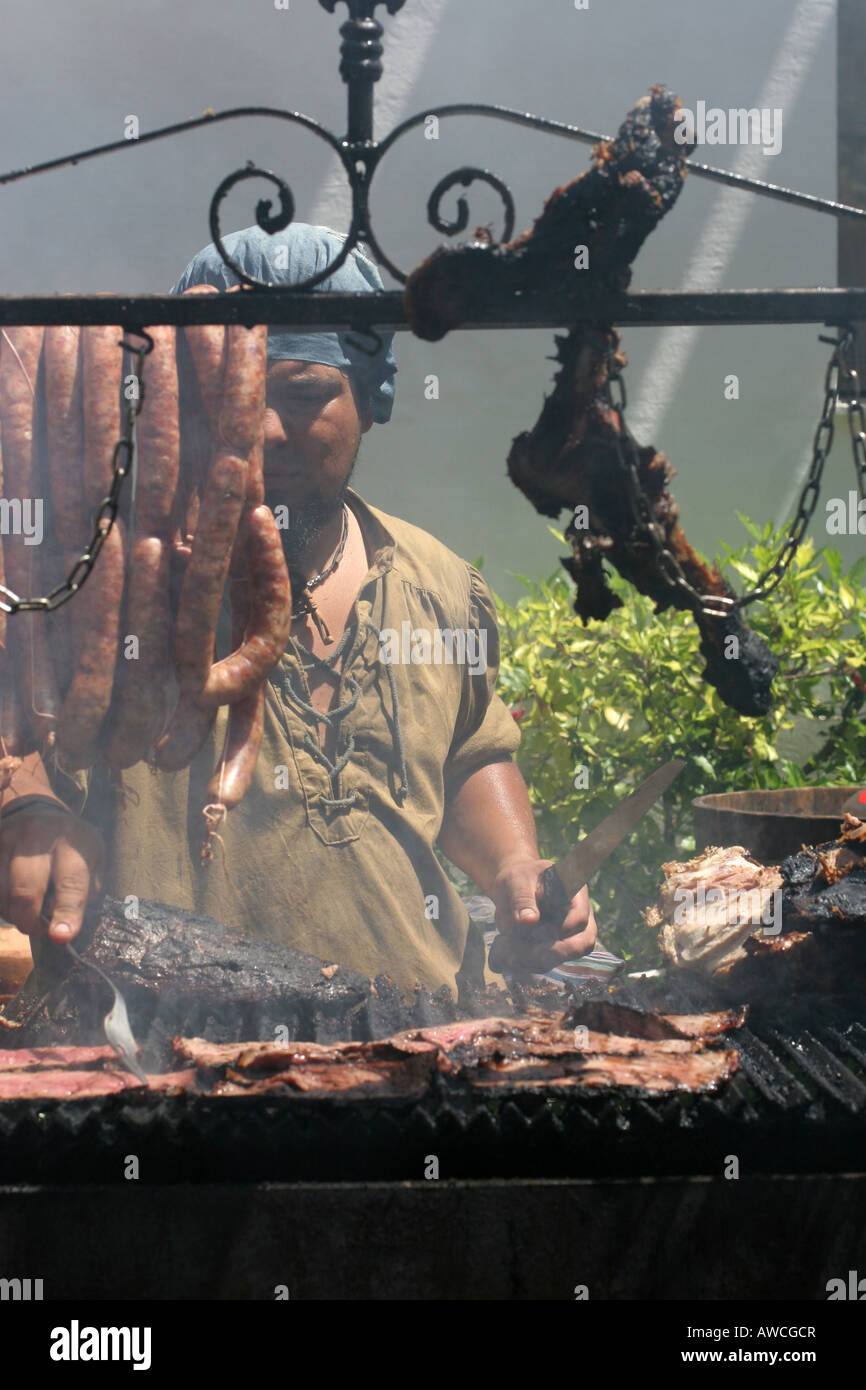Man cooking meat at the Medieval Festival in Ibiza Town This festival ...