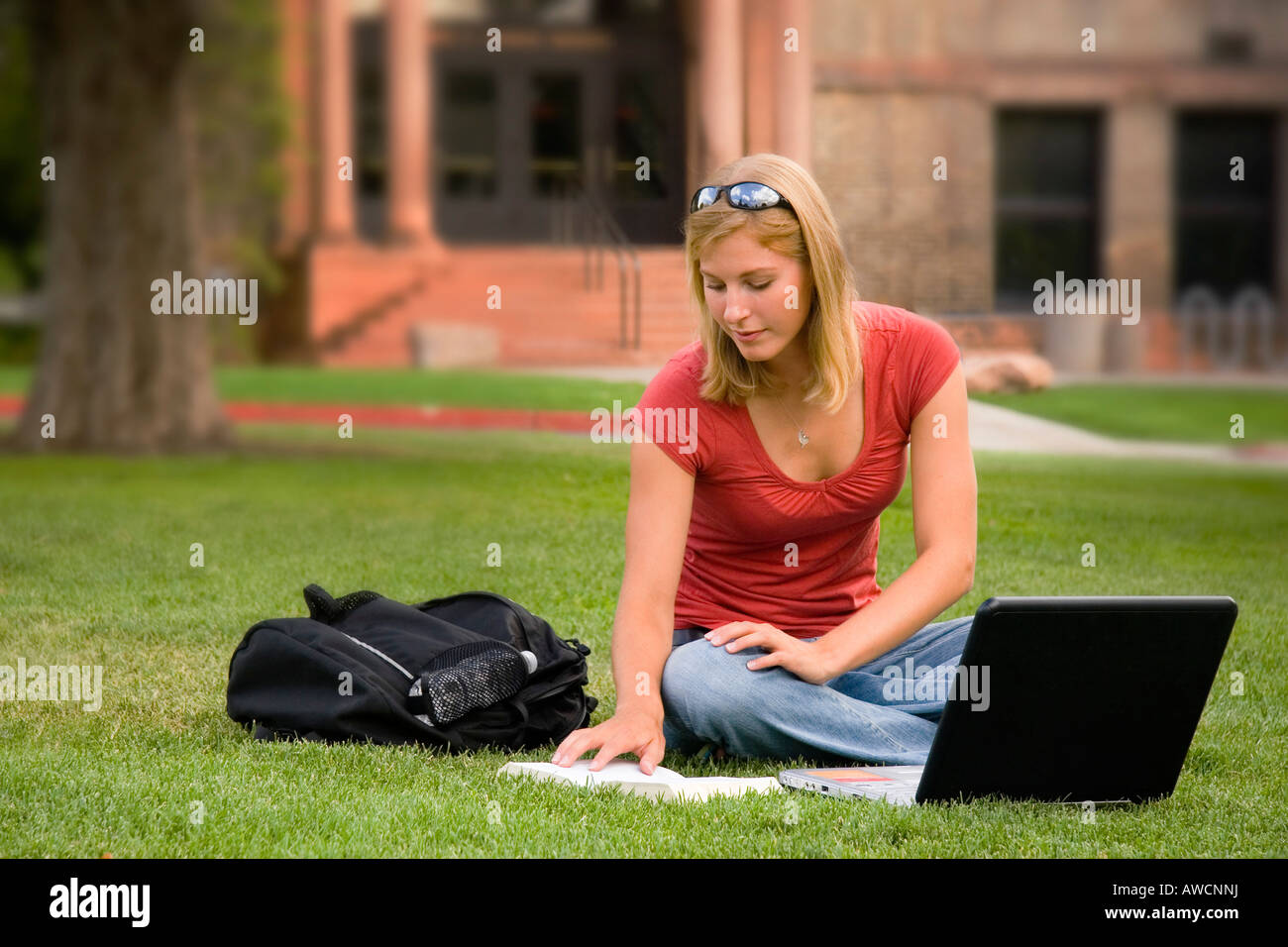 Young blonde female college student studying on campus Stock Photo - Alamy