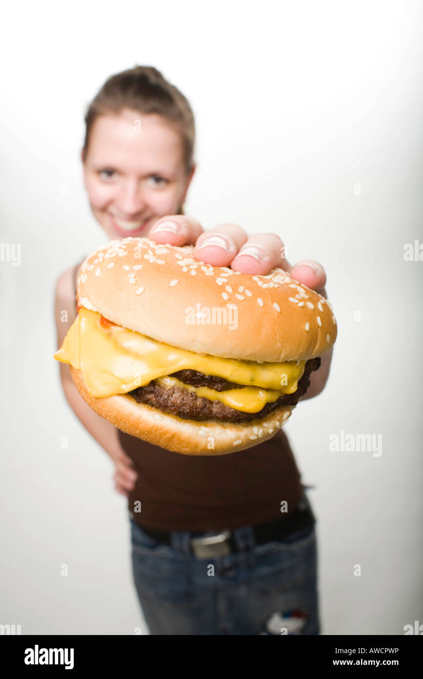 Blonde woman eating burger hi-res stock photography and images - Alamy