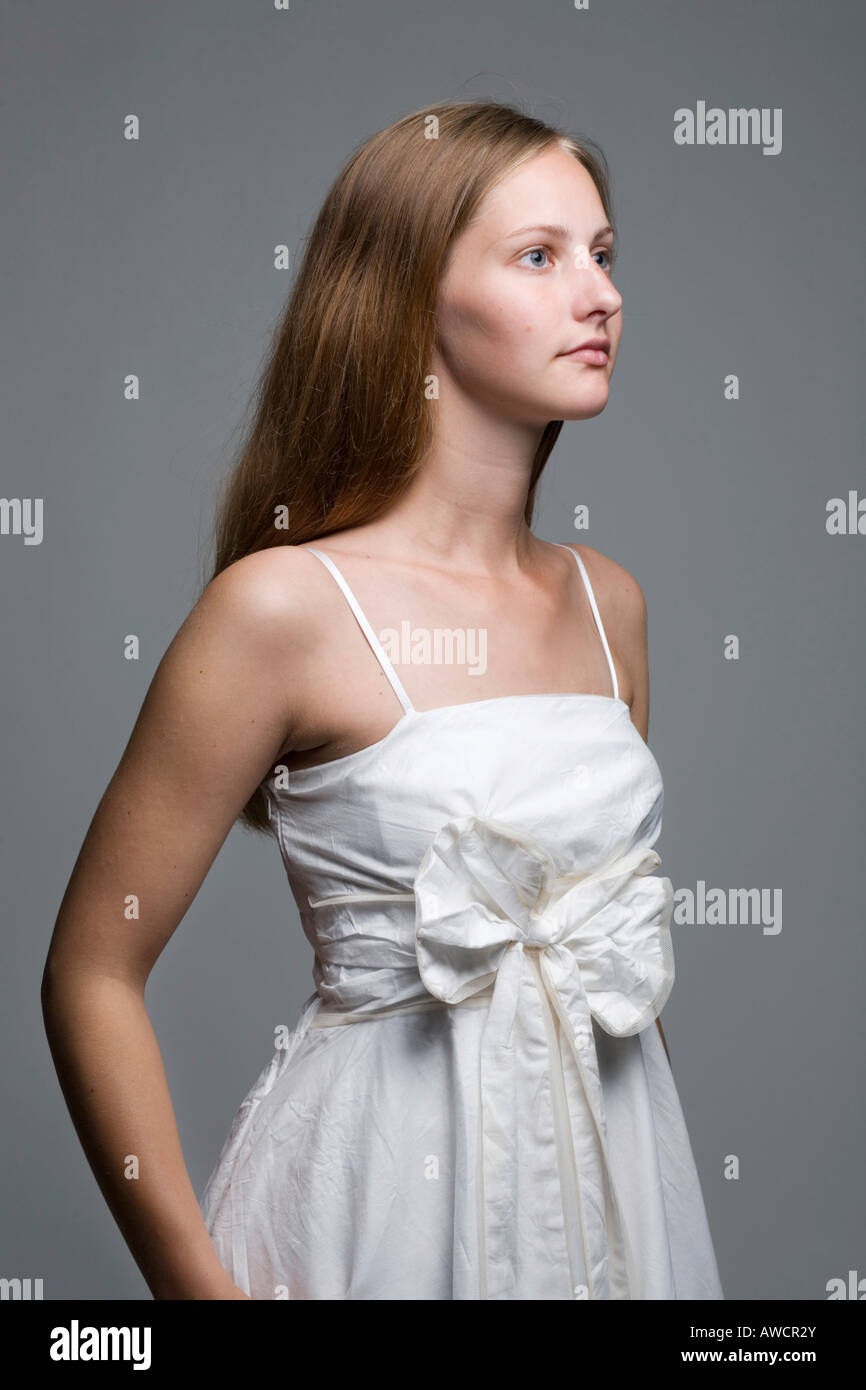 Long-haired woman wearing a white dress Stock Photo - Alamy