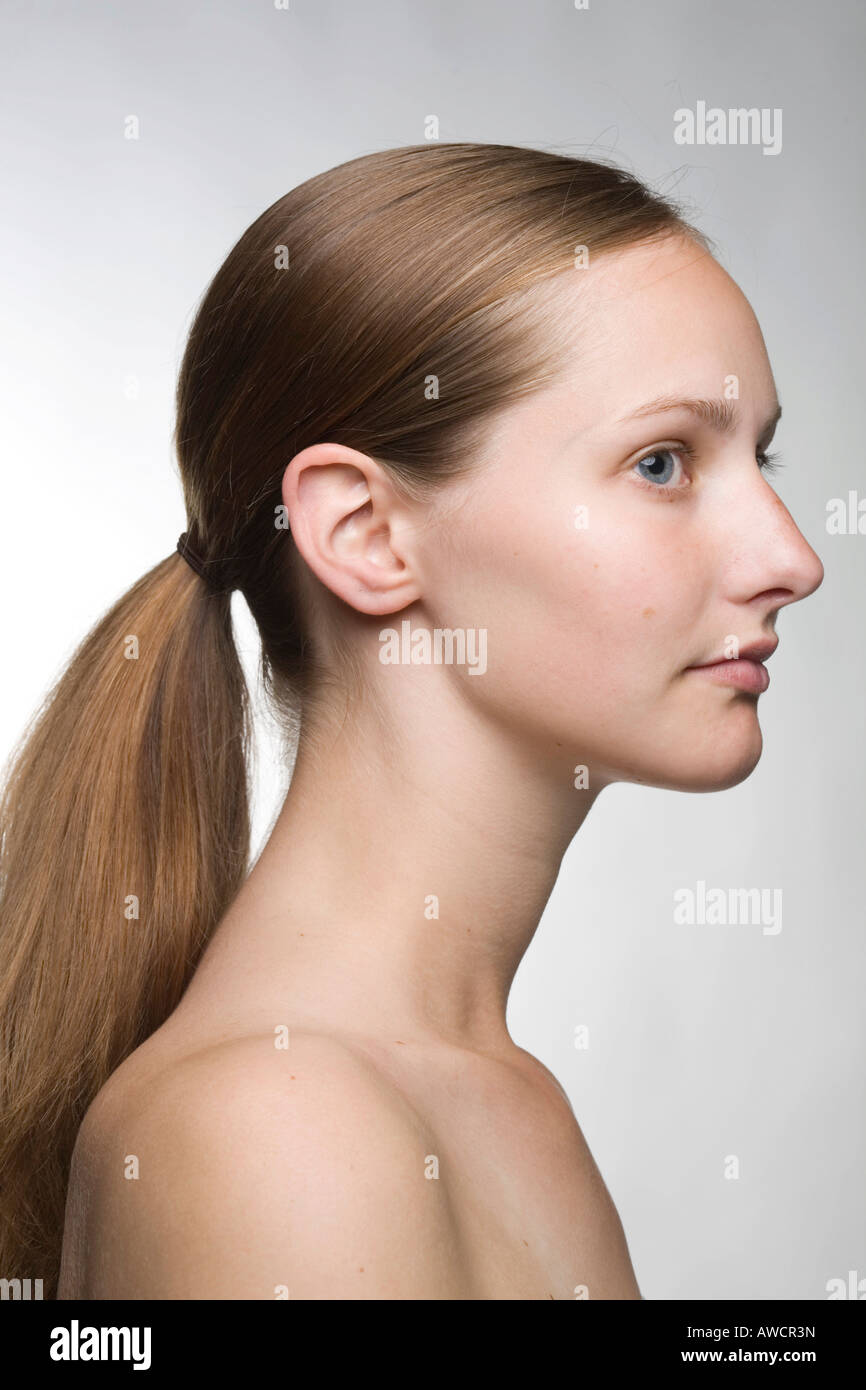 Portrait of long-haired woman with ponytail, profile Stock Photo - Alamy