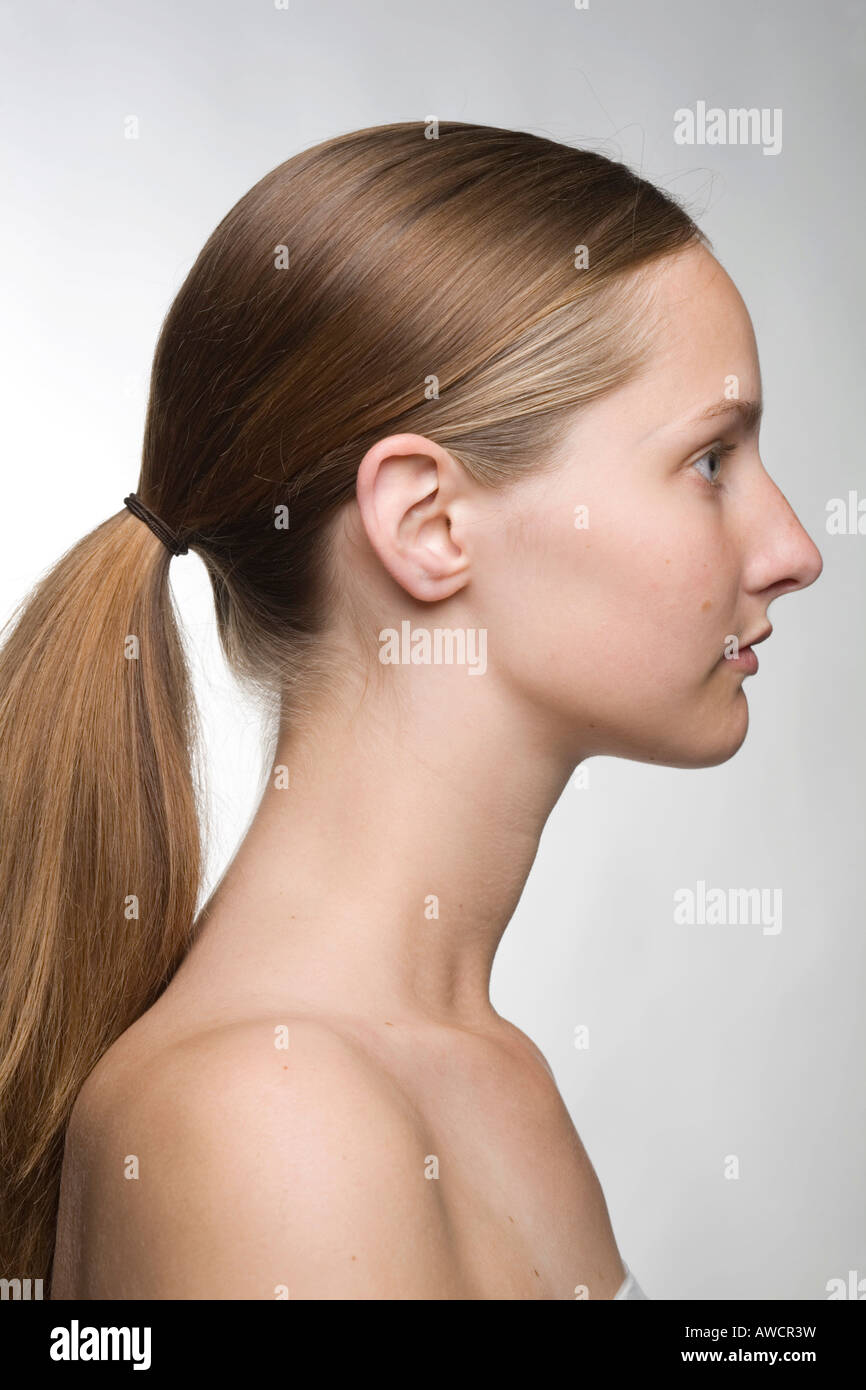 Portrait of long-haired woman with ponytail, profile Stock Photo - Alamy