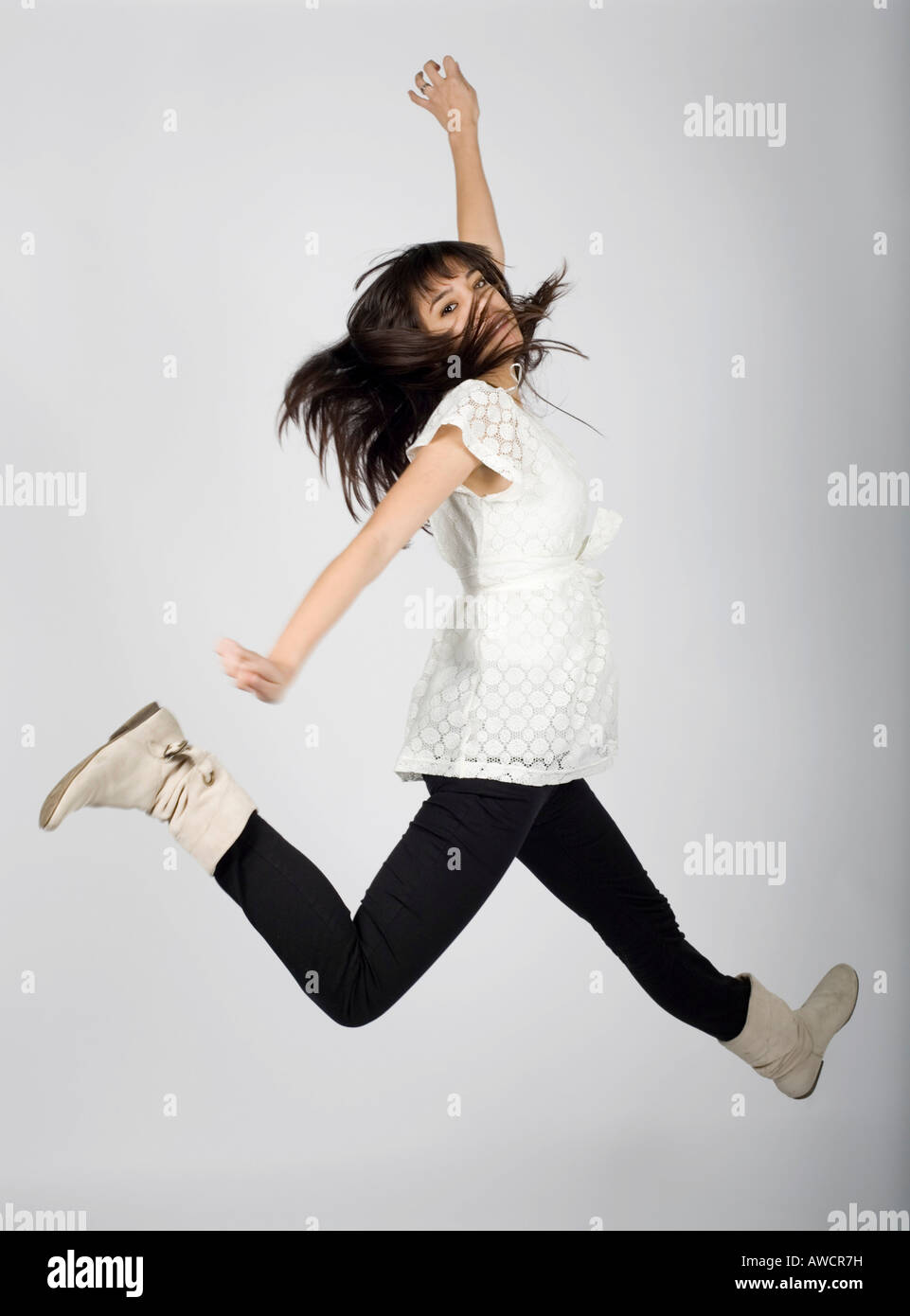 Jumping young woman Stock Photo - Alamy