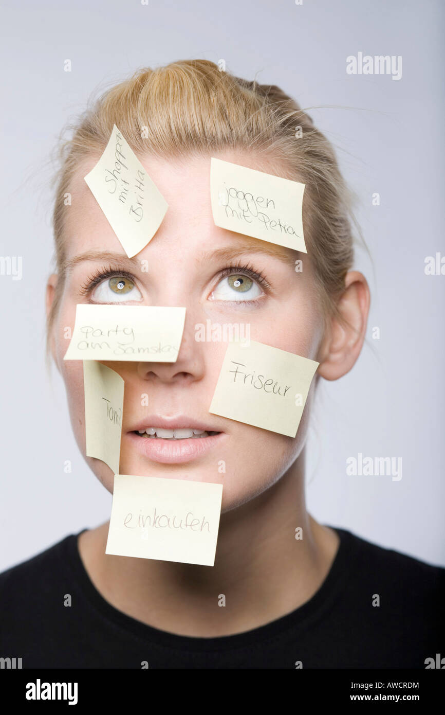 Young woman with many Post-it notes in the face Stock Photo - Alamy