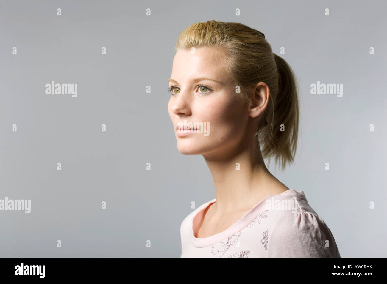 Portrait of a blonde woman with ponytail Stock Photo - Alamy