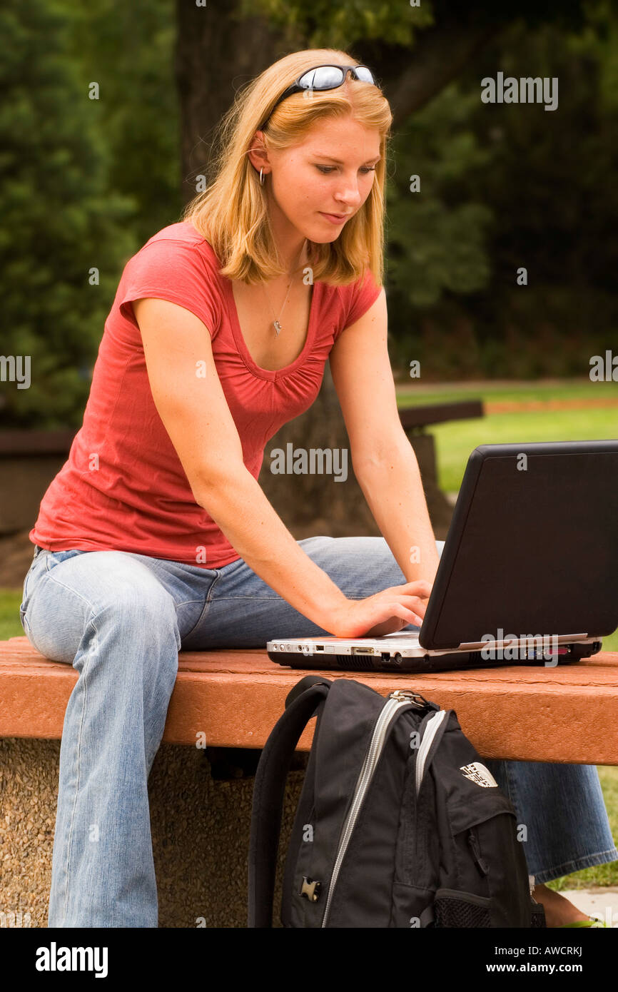 Young blonde female college student studying on campus Stock Photo - Alamy