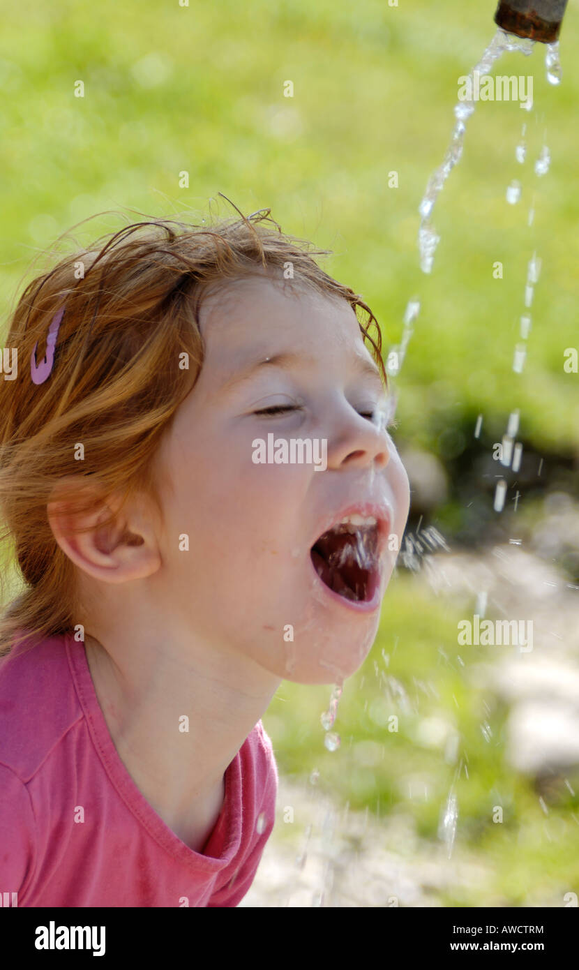 Child drinking from water fountain hi-res stock photography and images ...