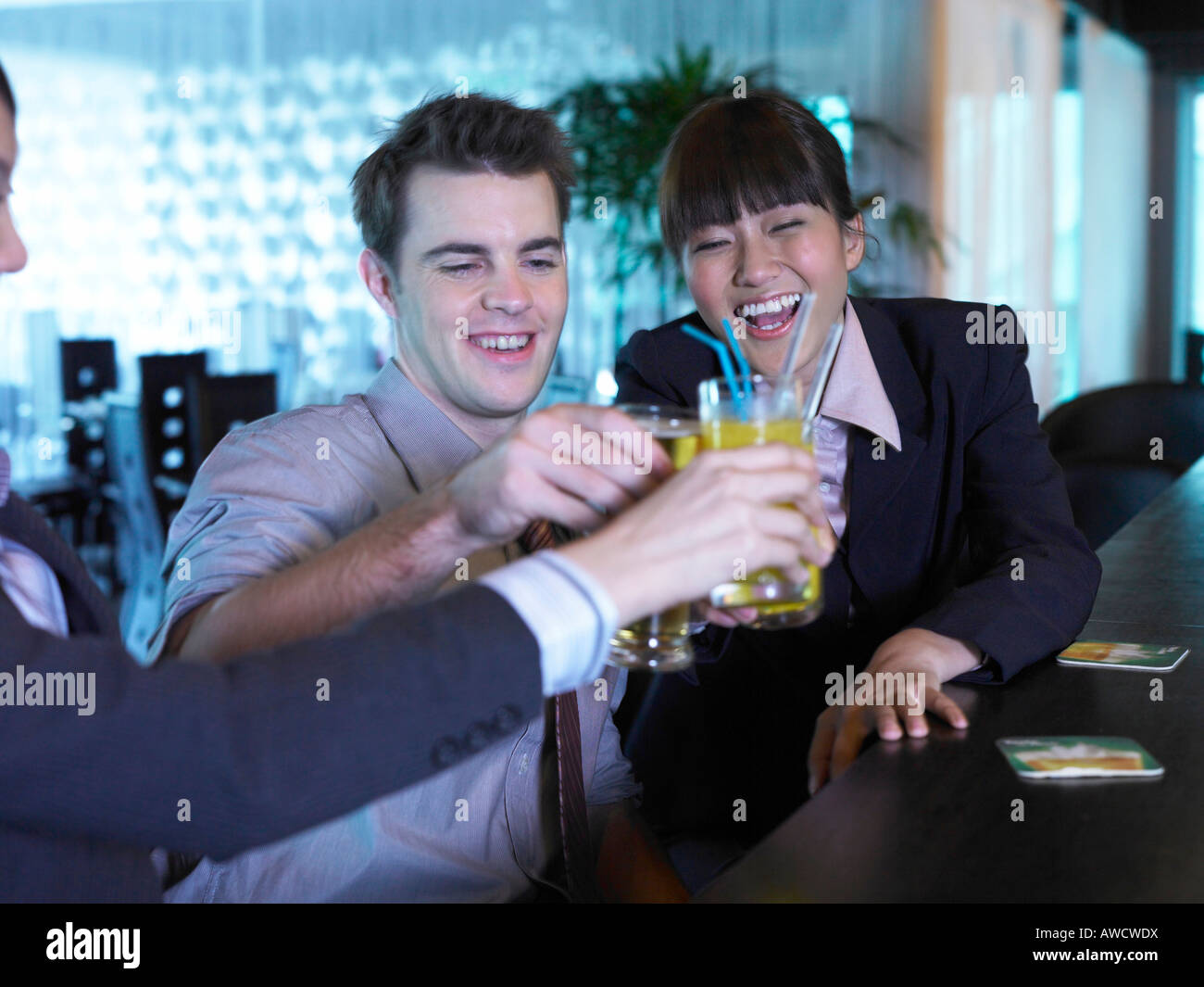 Coworkers meet in a bar after work to toast a new deal Stock Photo - Alamy