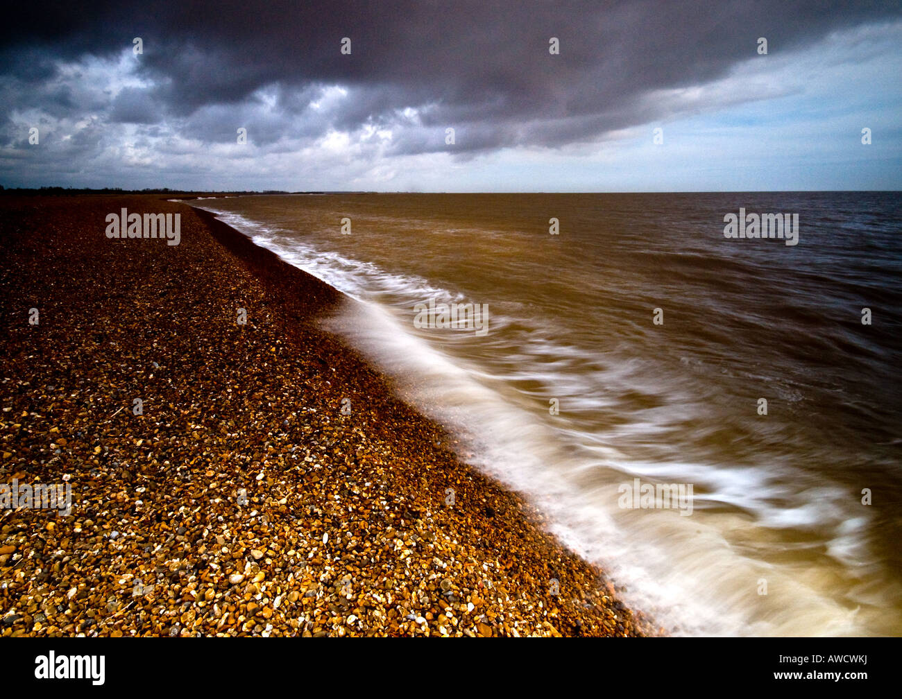Shingle Street Suffolk - incoming waves and a threatening weather front ...