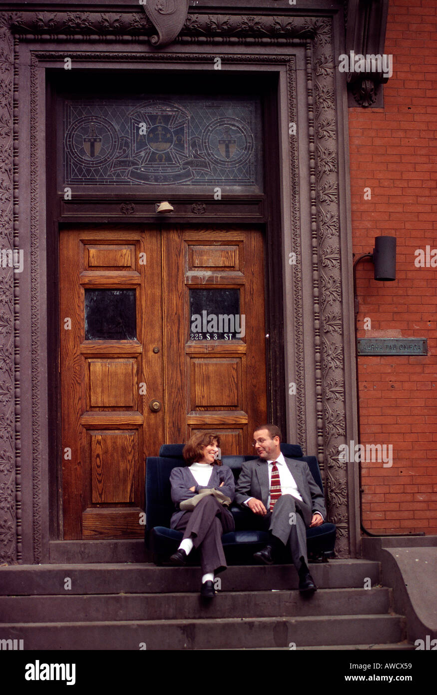 Two people waiting on steps hi-res stock photography and images - Alamy