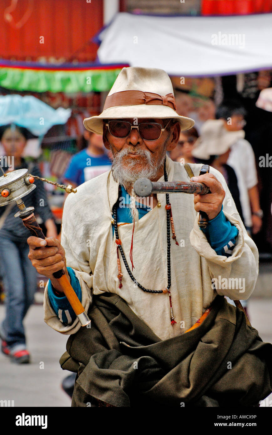 Old Tibetan man with prayer mill, Barkor street, Lhasa, Tibet Stock ...