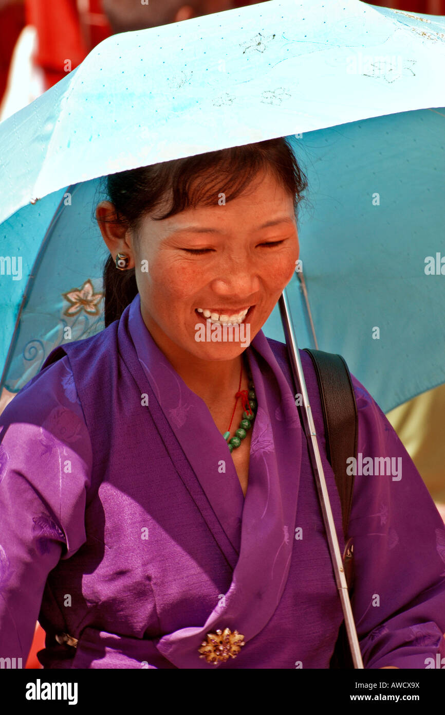 Young Tibetan woman with sun parasol, smiling, Lhasa, Tibet Stock Photo ...