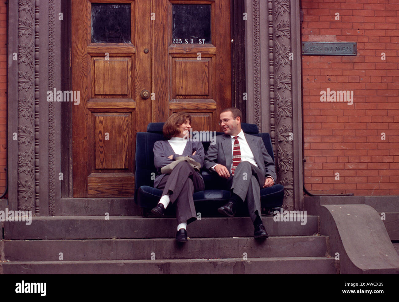 Two people waiting on steps hi-res stock photography and images - Alamy