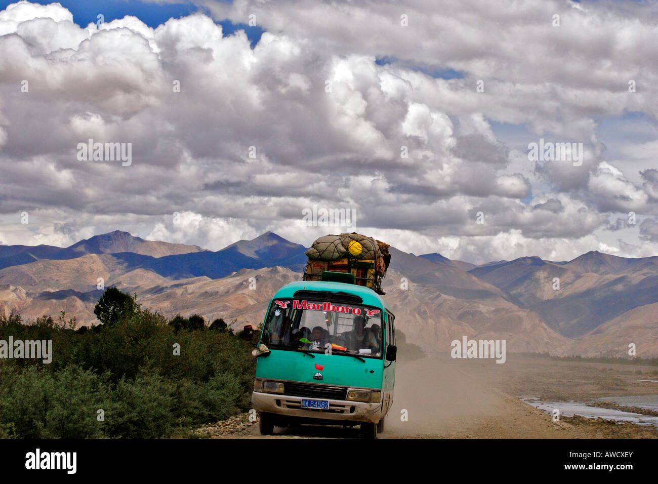 Heavy loaded bus travelling to Gyantse, Tibet Stock Photo - Alamy