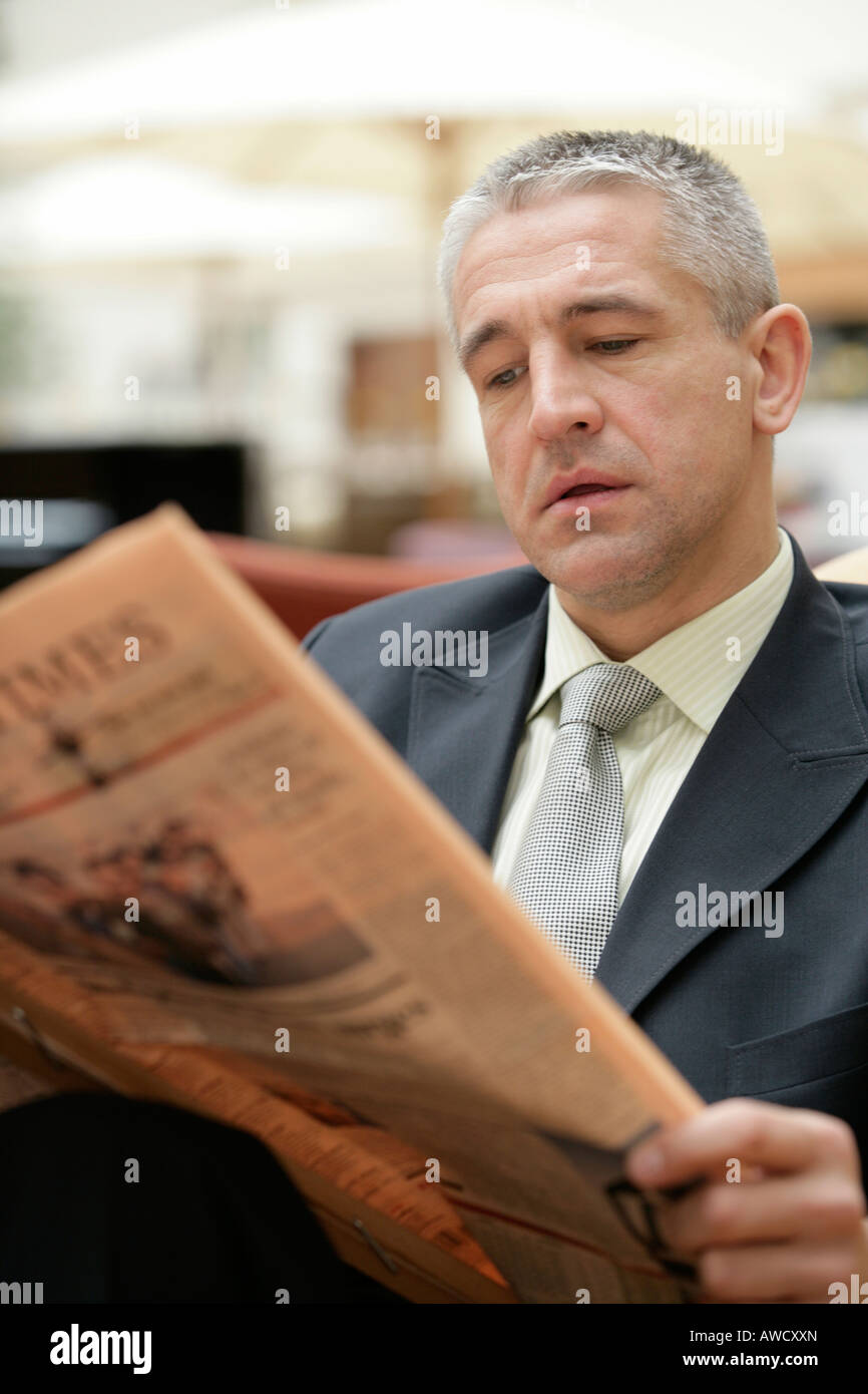 Reading newspaper in front of face hi-res stock photography and images ...