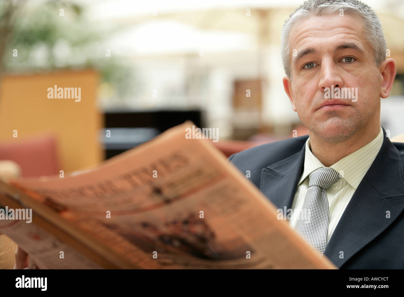 Businessman reading Financial Times Stock Photo - Alamy