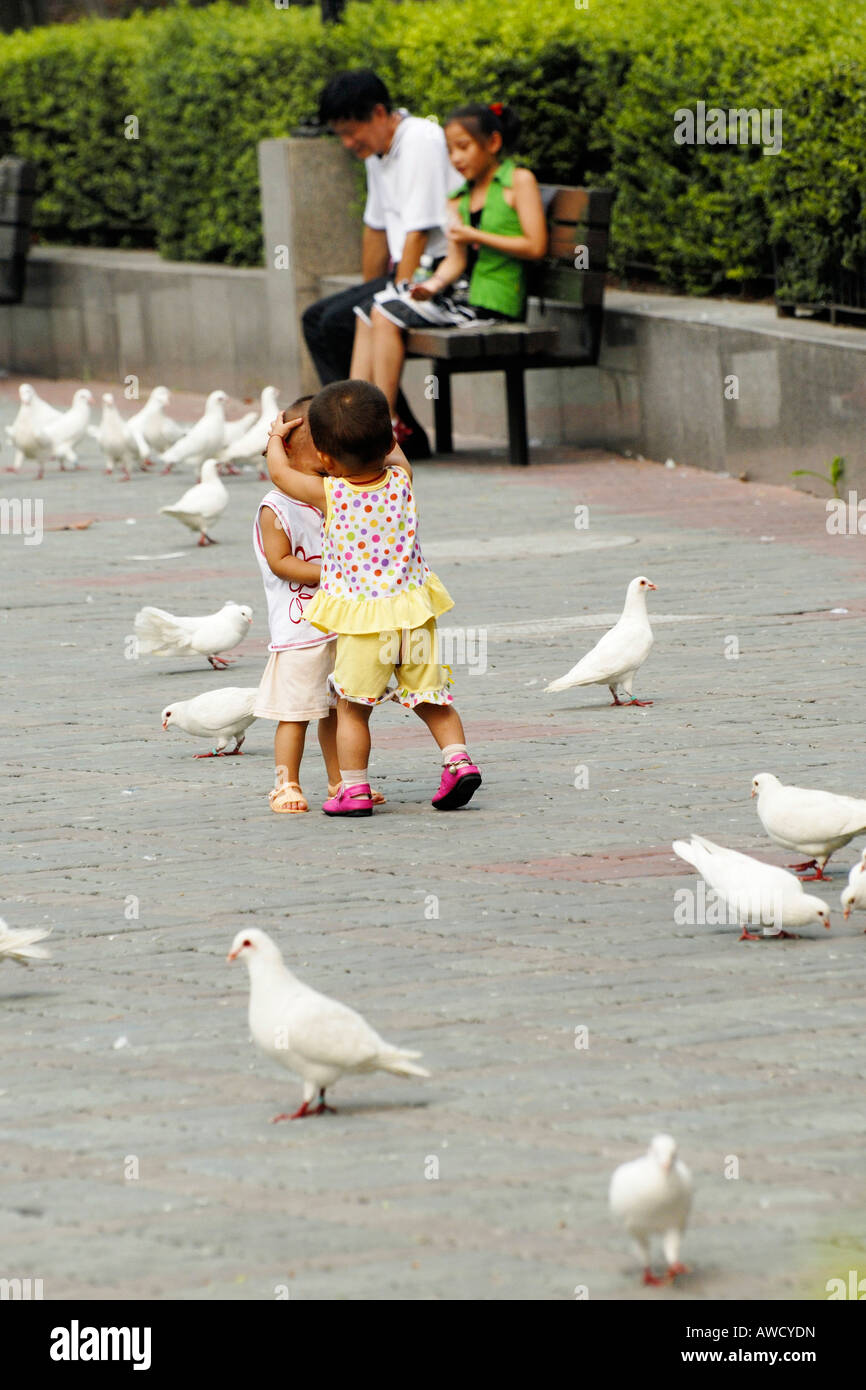 Child pigeons china hi-res stock photography and images - Alamy