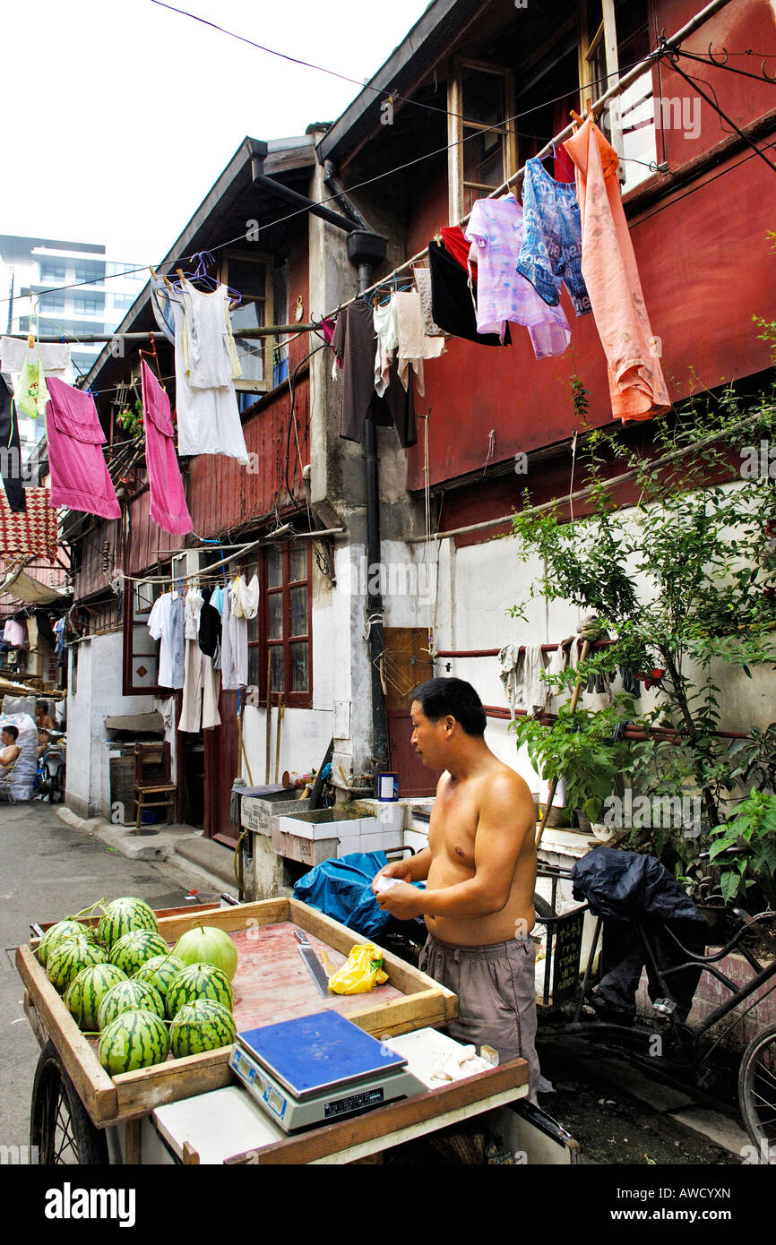 Old part of town, street scene, merchant selling melons, Shanghai ...