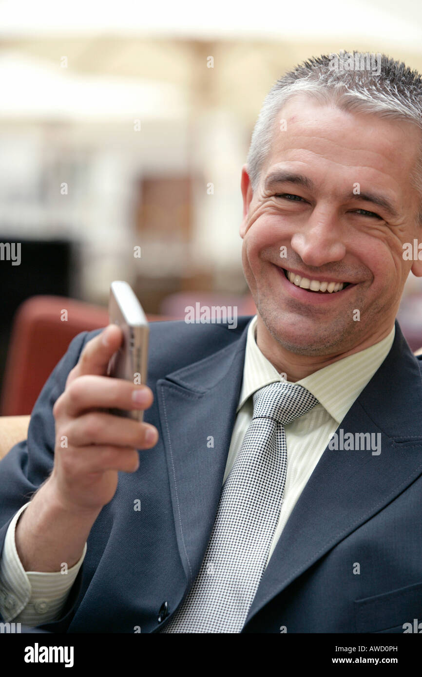 Portrait of man with cell phone Stock Photo - Alamy