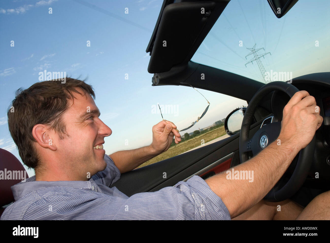 Man driving convertible Stock Photo - Alamy