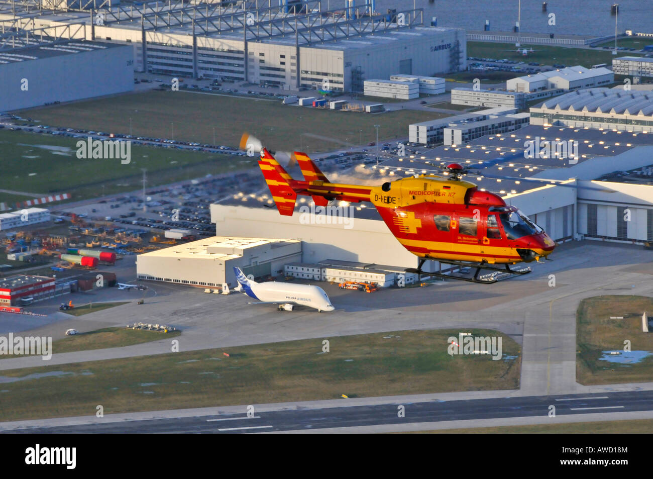 Eurocopter Medicopter BK 117 flying over the Airbus plant in Hamburg ...