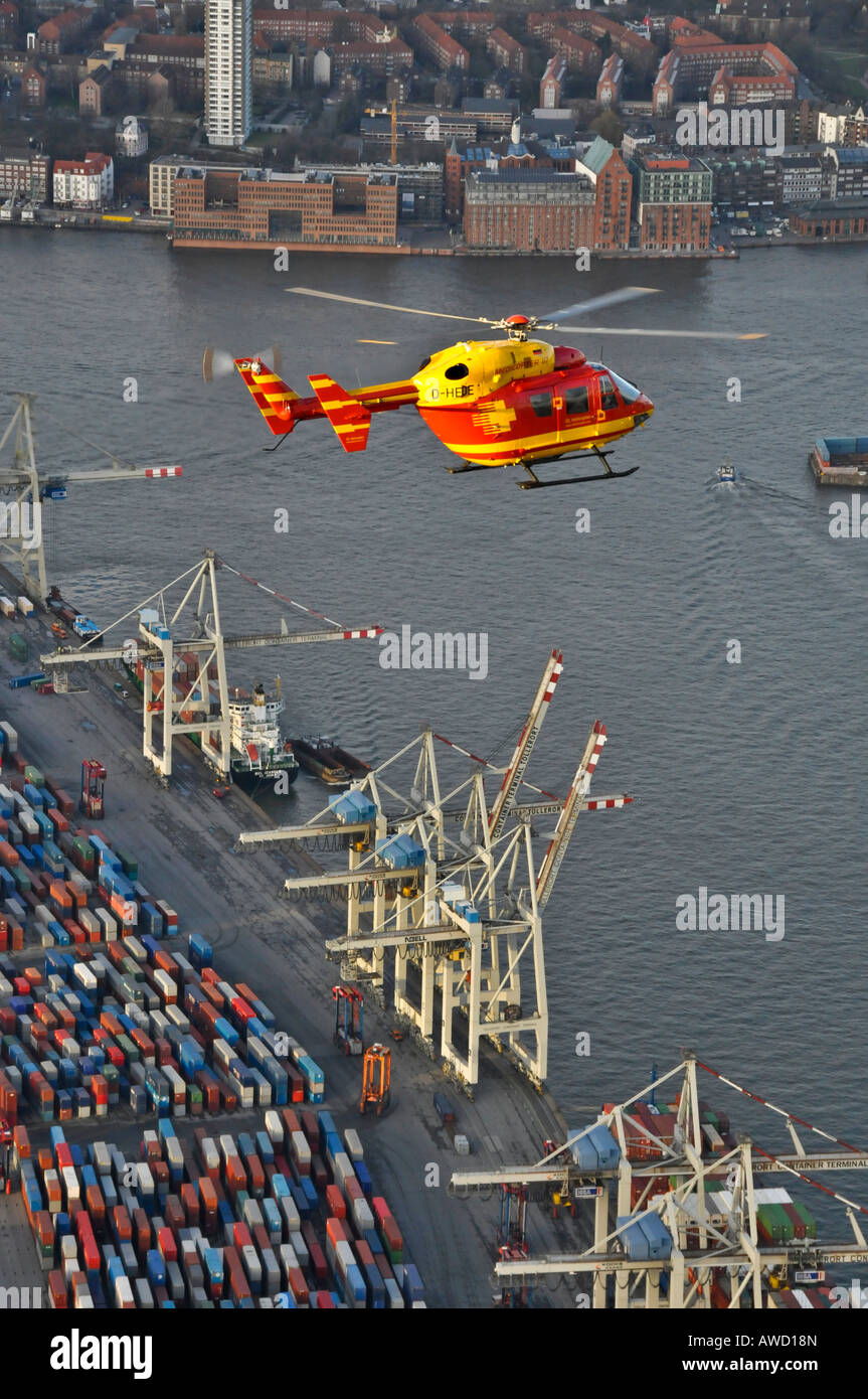 Eurocopter Medicopter BK 117 flying over the harbour in Hamburg ...