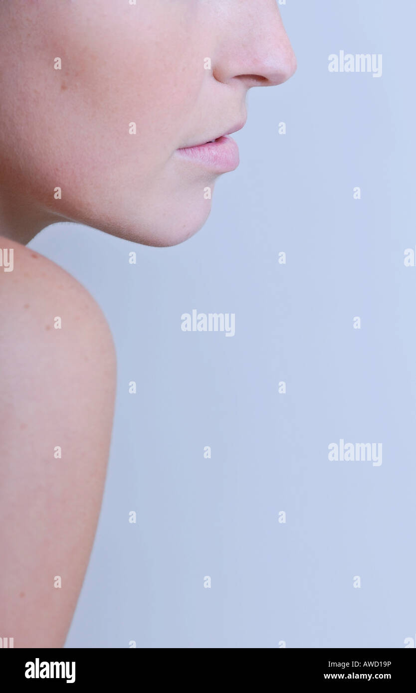 Young woman's profile, shoulder and partial face Stock Photo - Alamy