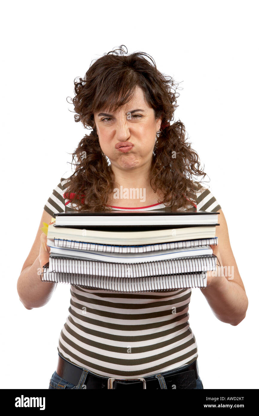 Busy young student woman carrying stacked files over a white background ...