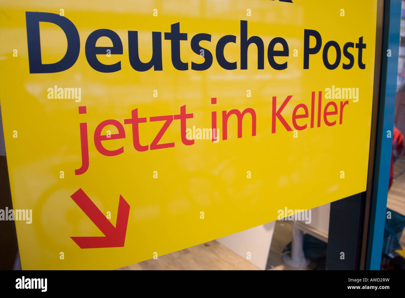 Sign marked with: Deutsche Post jetzt im Keller, Germany Stock Photo ...