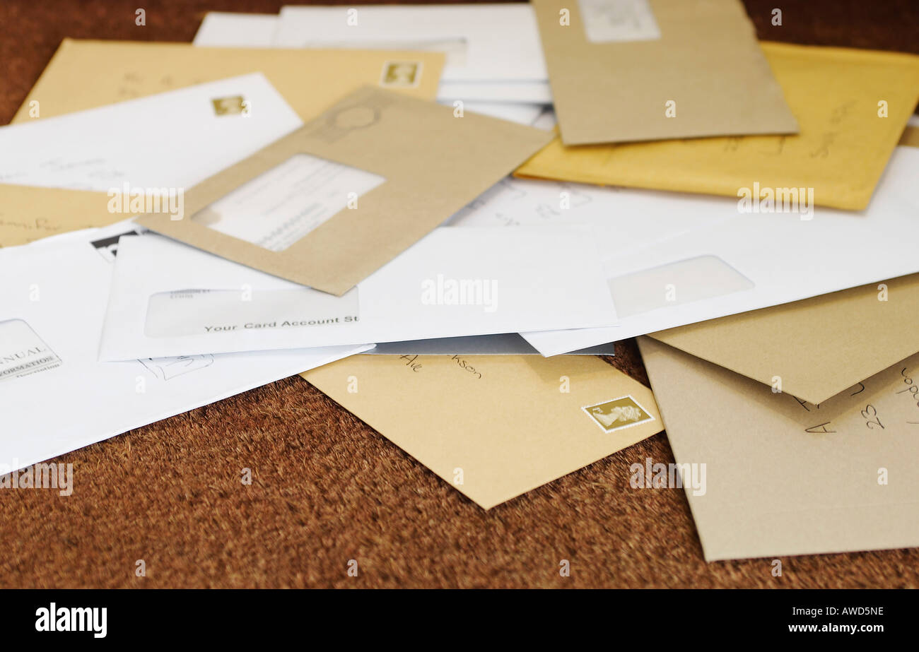 Pile of mail on doormat Stock Photo - Alamy
