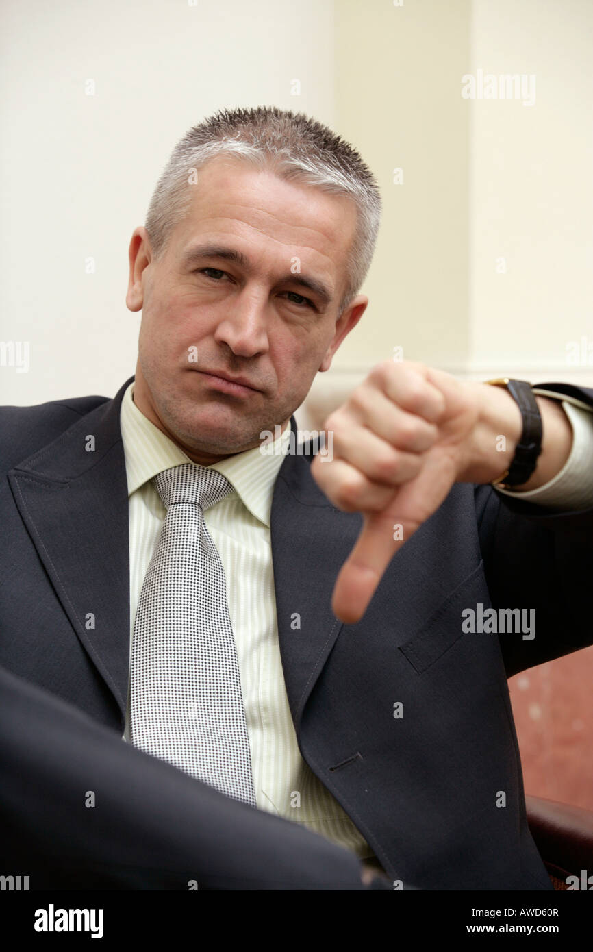 Thumbs down businessman sitting in hi-res stock photography and images ...