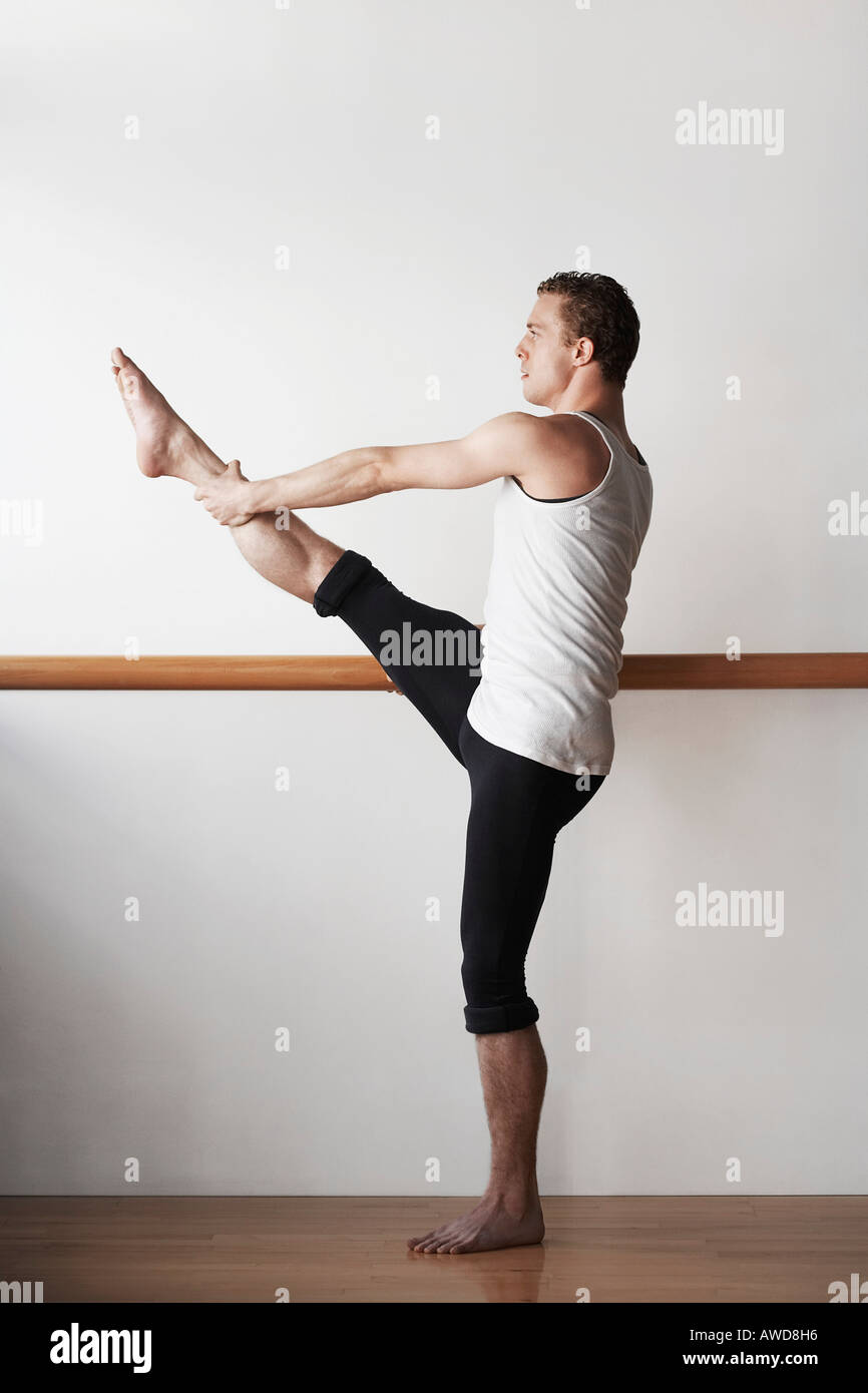 Ballet Dancer Stretching at bar Stock Photo - Alamy