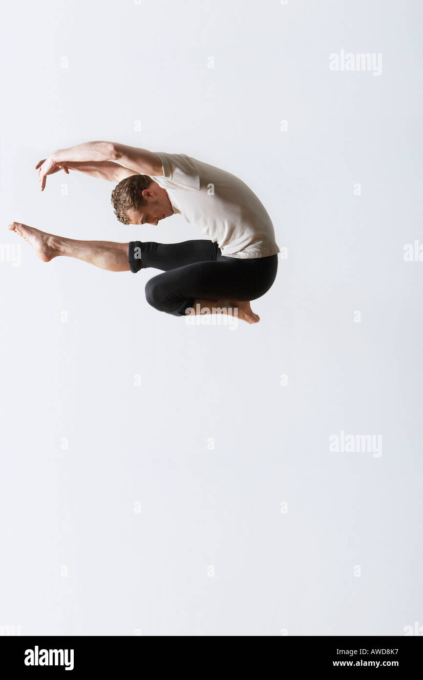Ballet dancer leaping in mid-air Stock Photo - Alamy