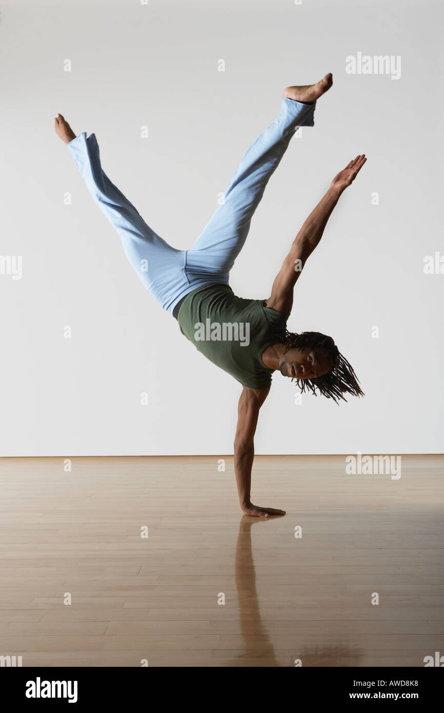 Ballet Dancer on one hand Stock Photo - Alamy