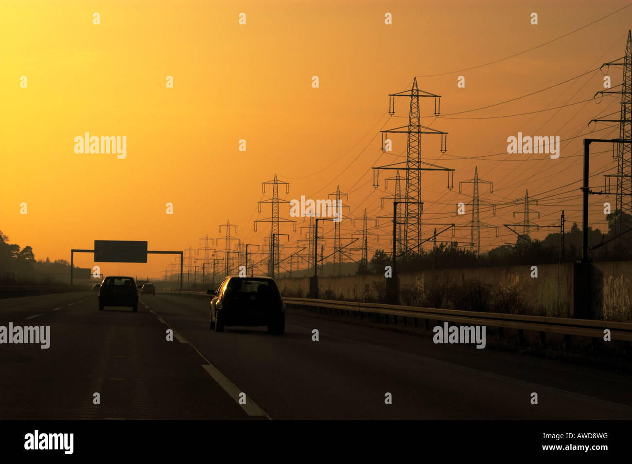 Transmission lines along a motorway Stock Photo - Alamy
